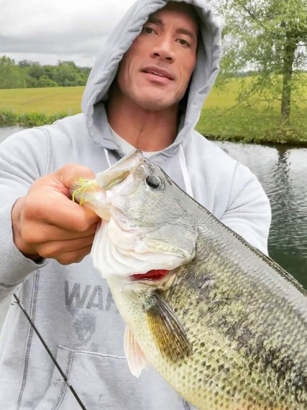 Dwayne 'The Rock' Johnson shows off the large fish he raises as a hobby